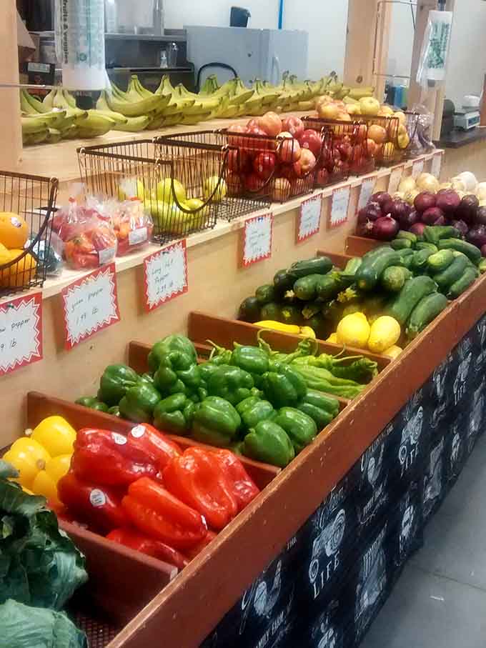 Red peppers, green peppers, yellow squash, and bananas. A produce section so colorful it could hang in a gallery.