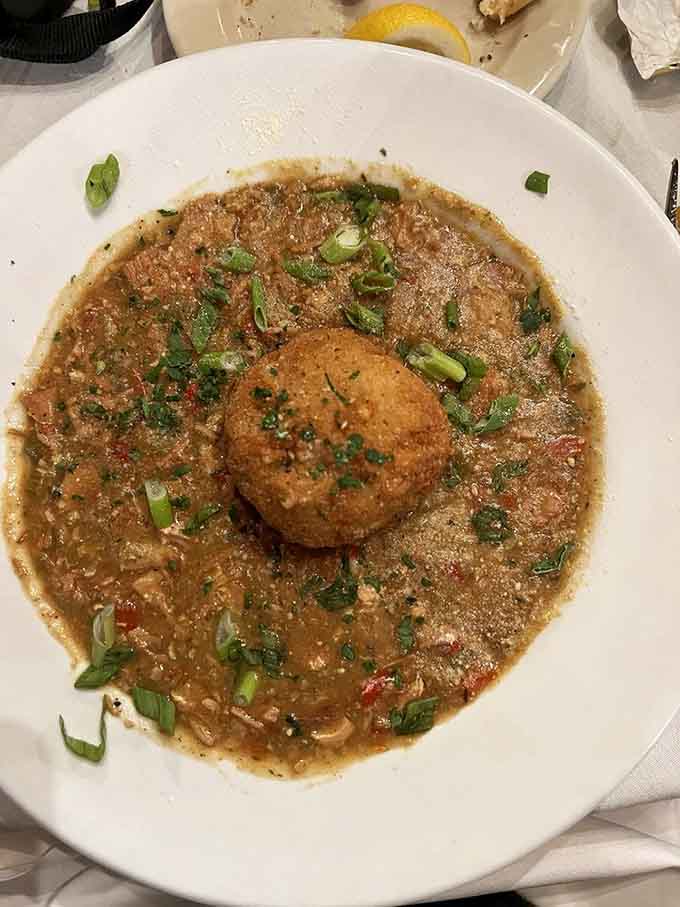A bowl of gumbo that looks like it's been simmering since the Continental Congress. Deeply satisfying and unapologetically bold.