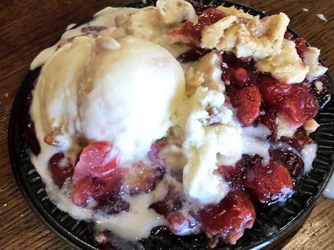 Cherry pie with a melting scoop on top, the kind of bowl that makes Tuesday feel like a celebration.
