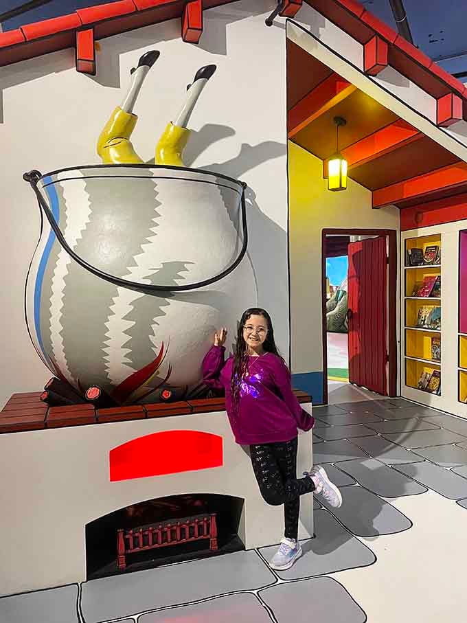 Legs sticking out of a giant pasta pot — Strega Nona's kitchen is exactly as chaotic and wonderful as you'd hope.