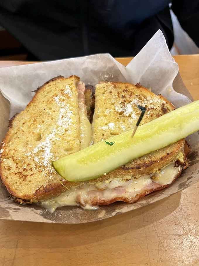 The Monte Cristo gets a Michigan makeover, proving that powdered sugar and pickles can absolutely be best friends.