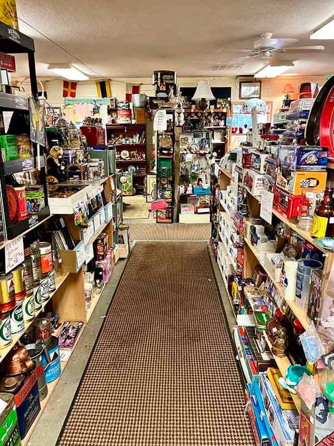 Floor-to-ceiling shelves packed with collectibles and curiosities, this aisle is the thrift store equivalent of a rabbit hole.