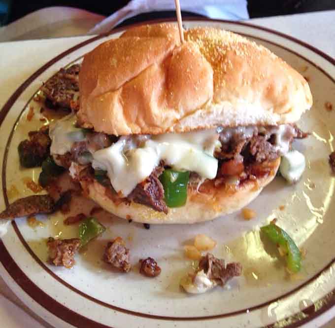 This Philly sandwich is stuffed so generously, it practically needs its own booth to sit in comfortably.