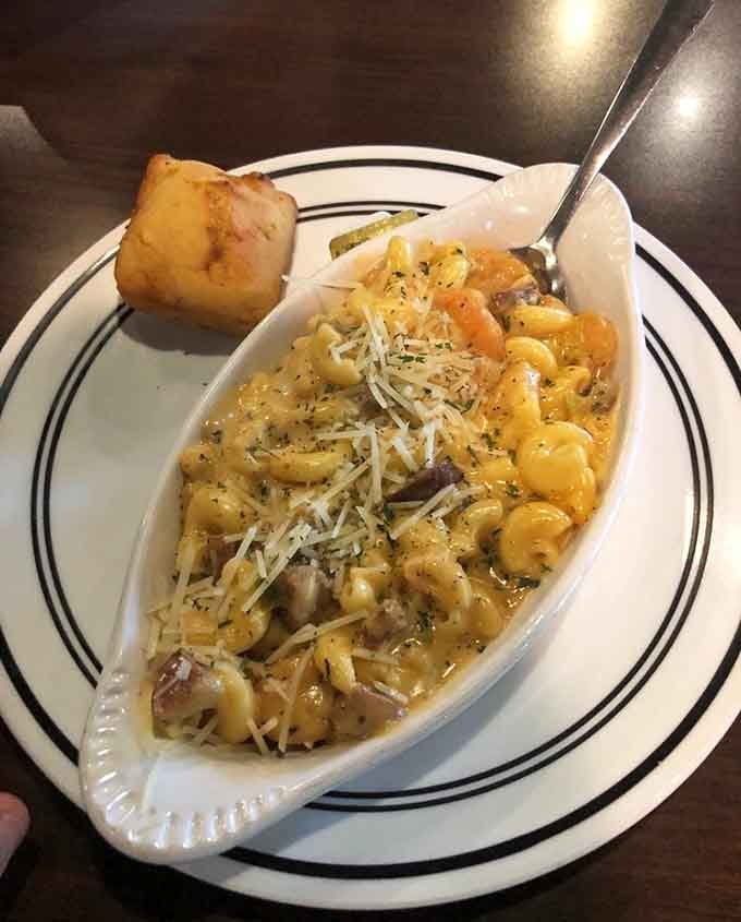 Cajun mac and cheese with shrimp, topped with Parmesan and served with cornbread, Louisiana just called and it approves.