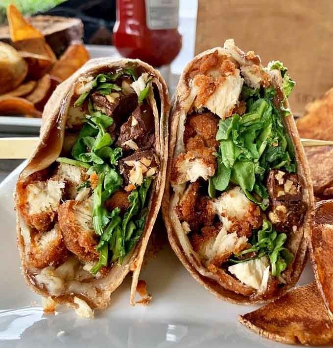 Crispy chicken, fresh greens, and enough filling to make you wonder why you ever ordered anything else.