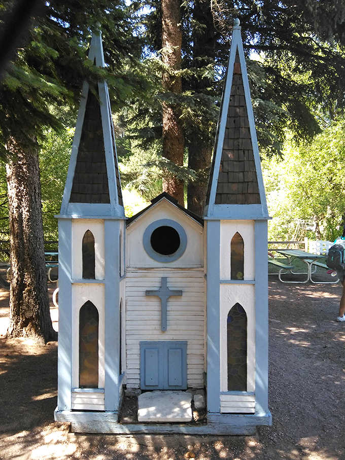 Twin spires reach toward the pines in this delicate white and blue chapel, where dappled sunlight does all the preaching.