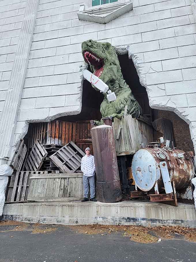 A T-Rex bursting through the wall is exactly the kind of neighbor nobody asked for but everyone loves.