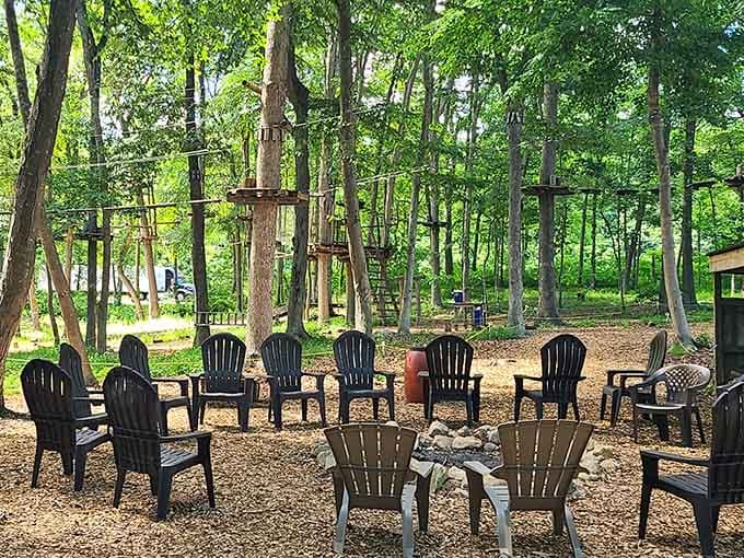 A circle of chairs around a fire pit, the perfect spot to swap treetop survival stories.
