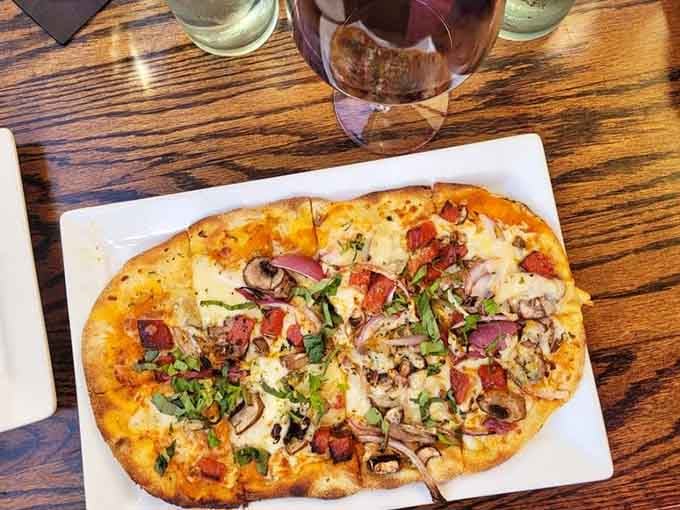 Crispy flatbread loaded with pepperoni, mushrooms, red onion, and fresh herbs. Simple pleasures, executed with real confidence and care.