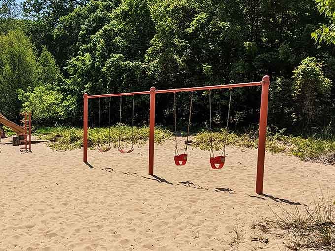 Swings in the sand beat swings over mulch any day, offering softer landings for daring young acrobats.