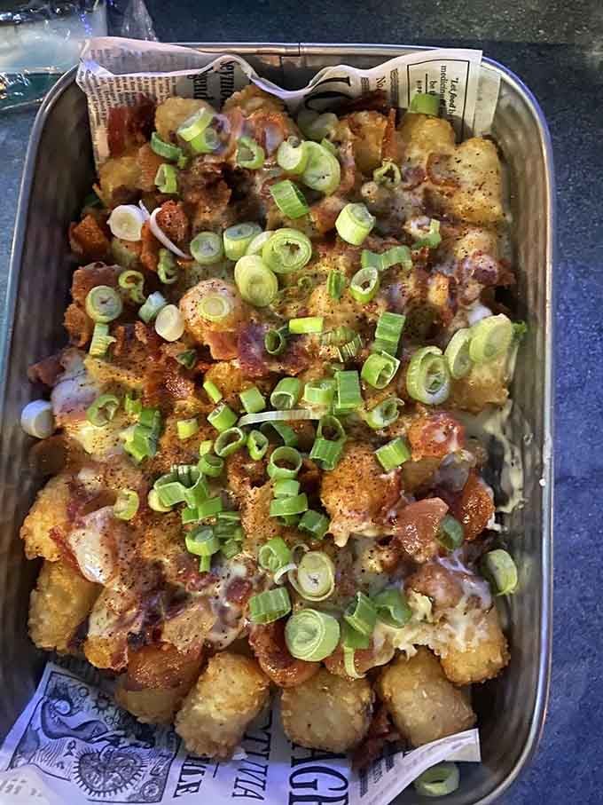 Crispy tater tots buried under melted cheese, bacon, and bright green onions, this is comfort food wearing its Sunday best.