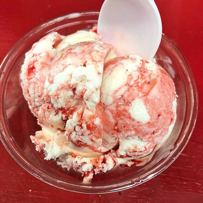 Strawberry swirled through creamy vanilla like a summer afternoon painted in dessert form.