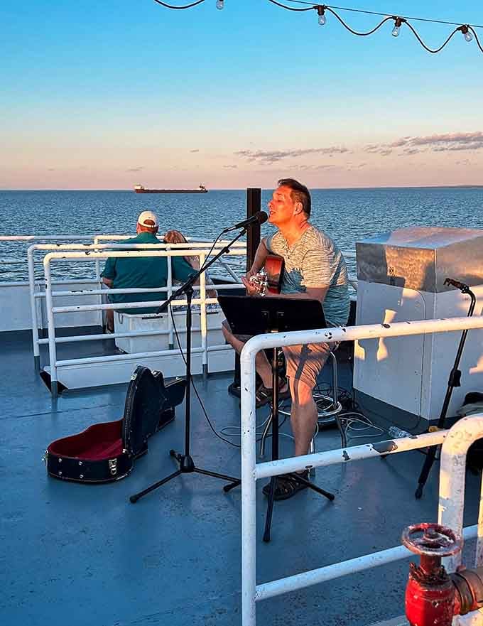 Live music on the deck, the lake stretching out forever behind him. This is not your average Tuesday night.