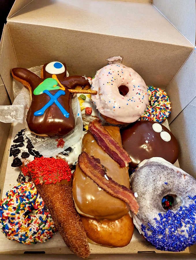 The Voodoo Dozen box is a colorful circus of bacon, sprinkles, pretzel sticks, and pure joy.