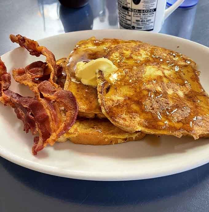 French toast with a butter pat melting slowly on top, crispy bacon alongside. Saturday morning called, and it approves.