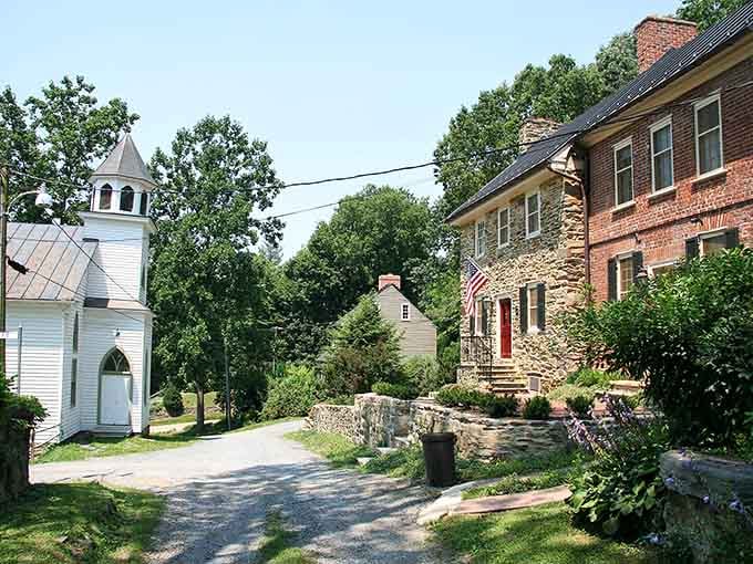 A white chapel, a stone house, and a road that curves like it has nowhere urgent to be.