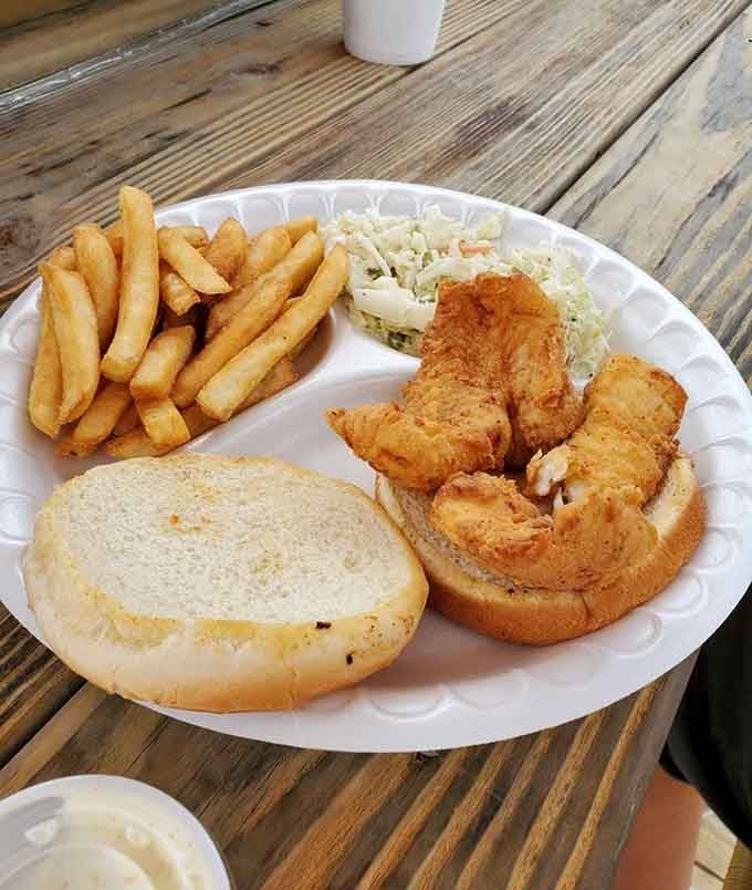Golden, crispy, and served with coleslaw and fries. This fish sandwich is the definition of no-frills perfection.