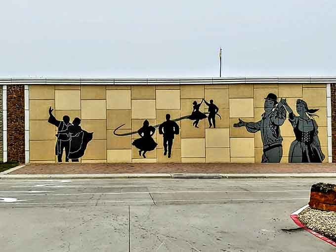 This mural celebrates Czech folk dancing with silhouettes that practically polka right off the wall into your heart.