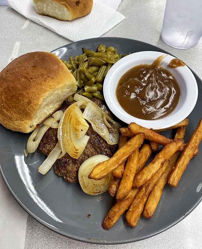 Hamburger steak with grilled onions, gravy, and all the fixings makes Wednesday the best day of the week, officially.