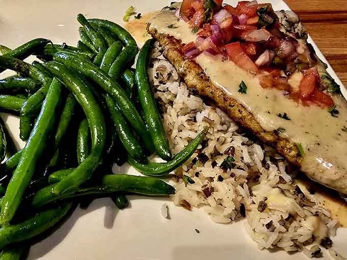 Walleye resting on wild rice with green beans alongside. Honest, beautiful food that knows exactly what it is.