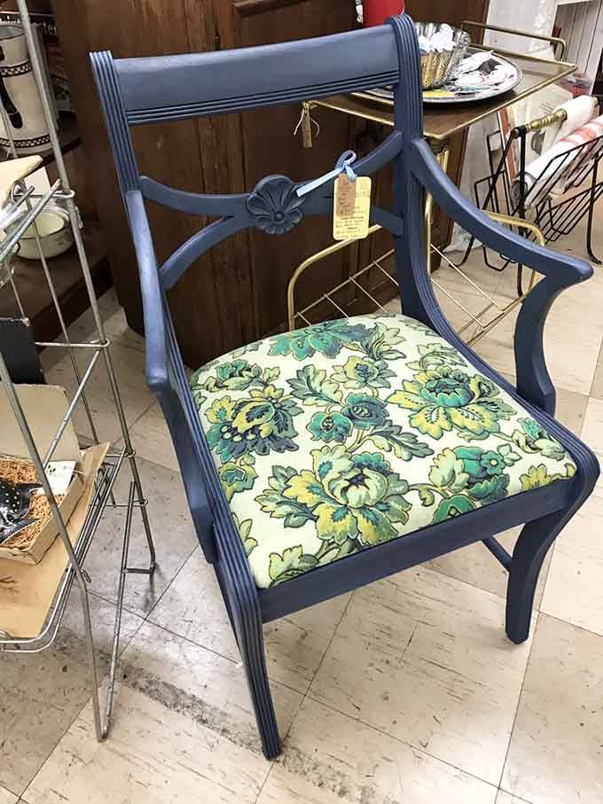 This bold navy chair with floral upholstery proves that old furniture can absolutely steal the spotlight.