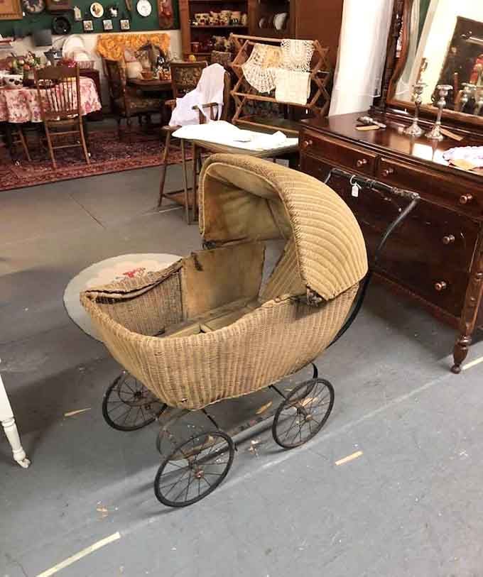A wicker baby pram so beautifully old-fashioned, it looks like it rolled straight out of a Victorian novel.