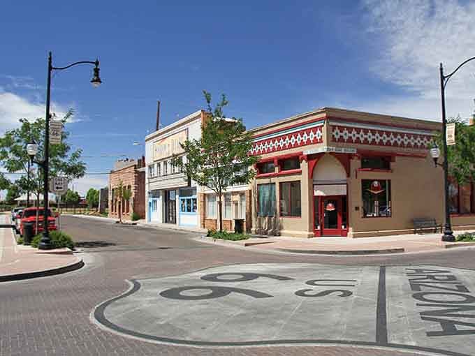 Standing at this Route 66 intersection, you can practically hear the Eagles playing in the background. No headphones needed.