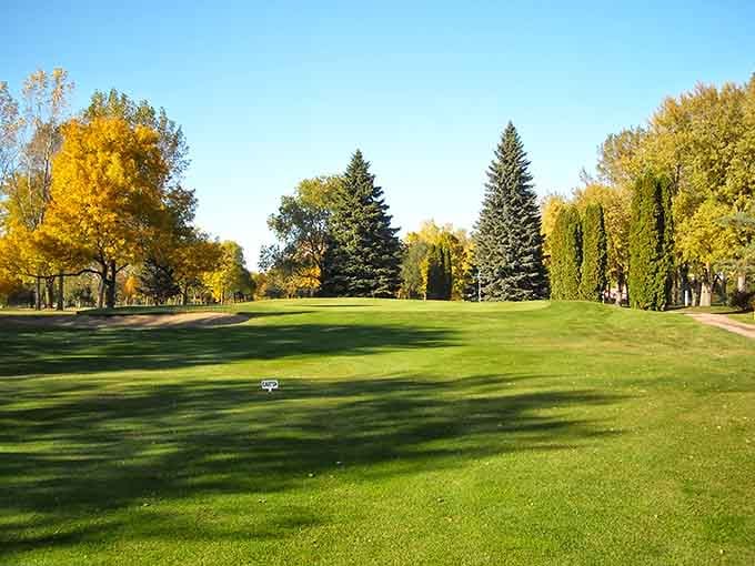 Fall colors frame the fairway at GreatLIFE Golf and Fitness Club like a painting someone forgot to put a price tag on.