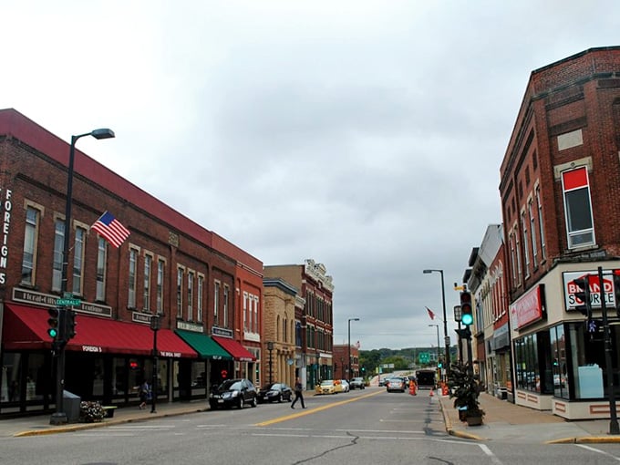 Chippewa Falls&rsquo; brick-paved State Street corner bursts with color and energy, where a waving American flag and lively storefronts create a scene worth savoring.