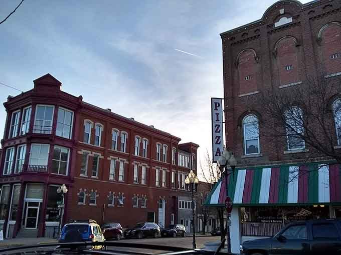 Fulton's pizza sign glows against a dusky winter sky, flanked by handsome red brick buildings that make even a cold evening feel inviting.