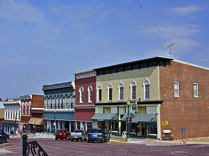 Pastel-painted storefronts in Mount Carroll look like someone colored them with Easter egg dyes and perfect taste.