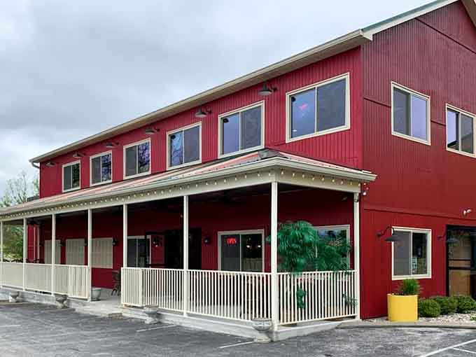Crimson siding that completely pops! Even under a gray, moody sky, that bright yellow planter adds a wonderful touch.