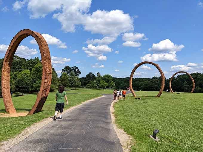 These towering metal arches guide visitors through outdoor galleries where art meets nature in unexpected ways.