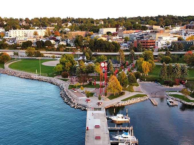 Petoskey's Little Traverse Bay sparkles at golden hour, with the iconic red clock tower standing watch over one very well-fed town.