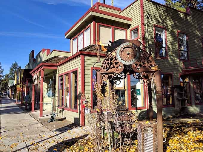 Rusty gears and colorful storefronts line this charming street, where creativity and good food share the same sidewalk.
