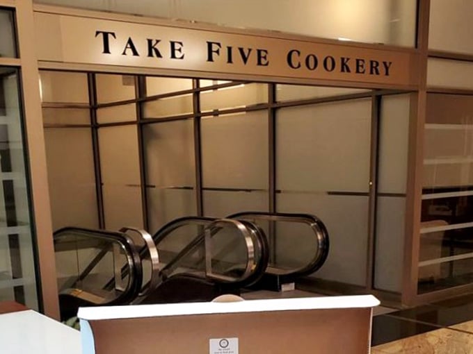 That escalator leading upward suggests downtown convenience meeting quality cooking, where lunch breaks become mini culinary adventures worth taking.