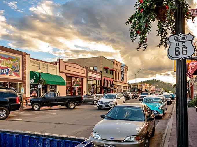 Golden sunset light, pine-covered hills, and a Route 66 sign overhead &mdash; Williams delivers the full American road trip package.
