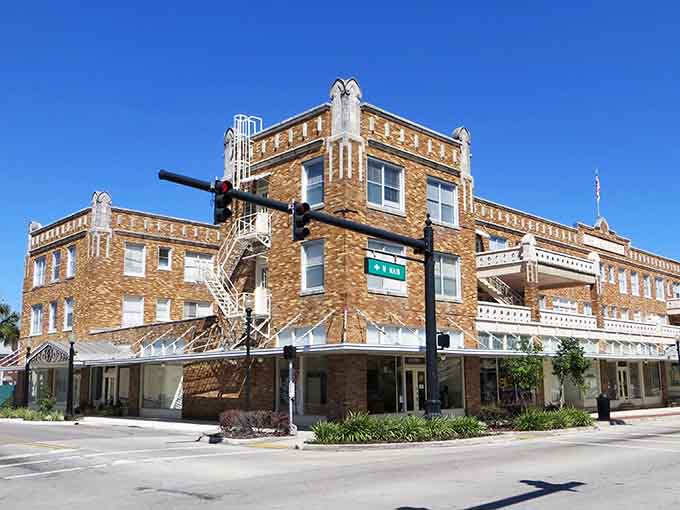 Step back and admire those decorative parapets on Avon Park's historic corner building — craftsmanship like that doesn't happen by accident.