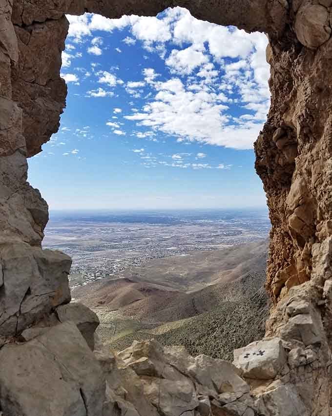 The whole city of El Paso spreads out through this rocky window like the world's most dramatic living postcard.