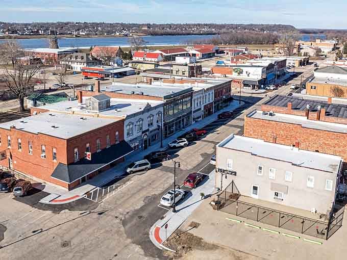 Take a bird's-eye view of this lovely historic downtown, stretching past brick storefronts toward the scenic riverfront winding beyond.