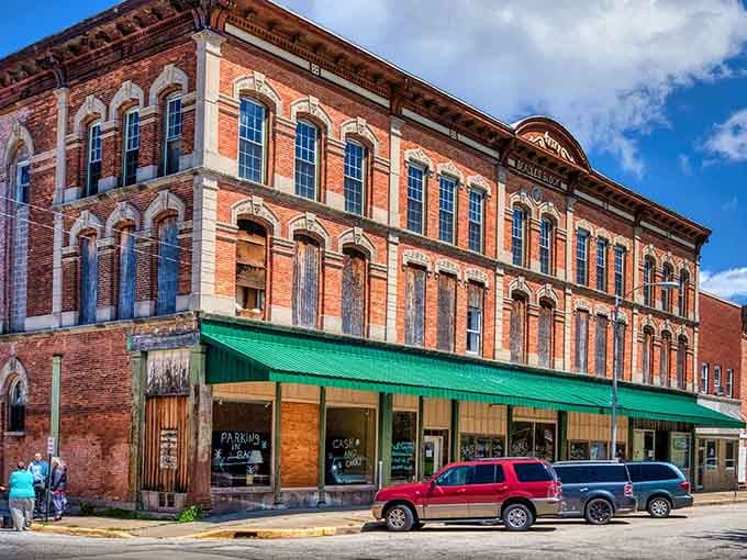 That gorgeous Italianate corner building in Fulton, with its arched windows and green awning, is the architectural equivalent of a firm handshake.