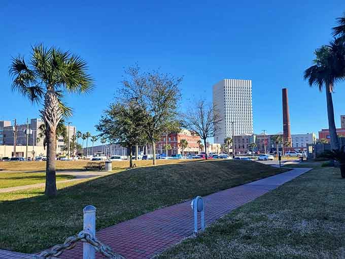 Palm trees, brick pathways, and a wide open sky give this Galveston green space a breezy, unhurried charm all its own.