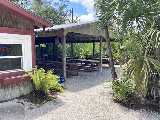 A gravel path, a thatched overhang, and the Florida wilderness pressing in from every side &mdash; lunch here feels like a genuine adventure.