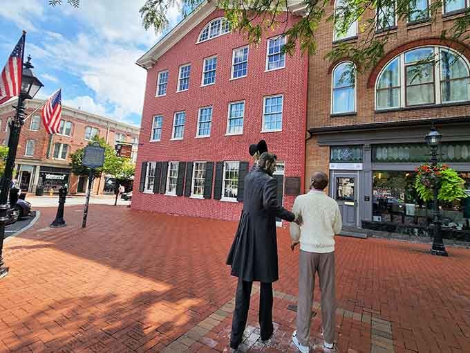 Bronze figures stand quietly before a tall brick building, reminding every visitor that Gettysburg's stories still echo loudly.