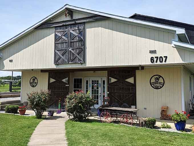 Vintage red wagon wheels and cheerful flower pots tucked beside the barn doors give Grimes Mill Winery a personality as rich as its wines.