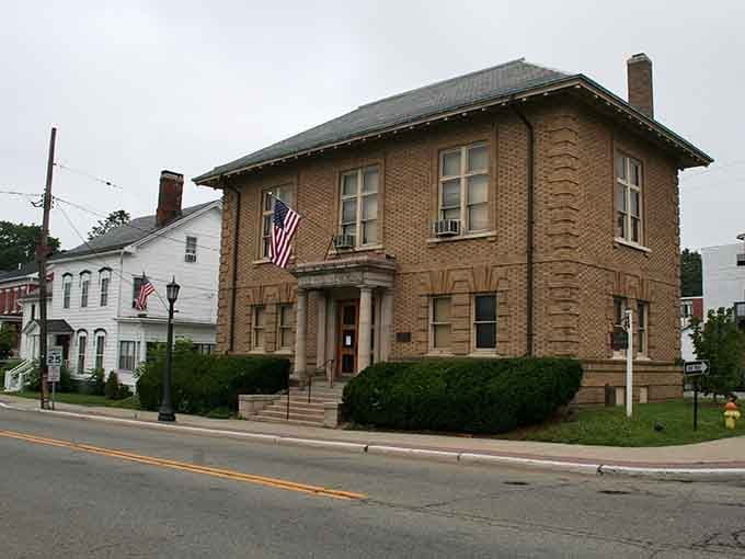 Newton's handsome public library building stands at attention, two flags flying, proud as any landmark in the state.