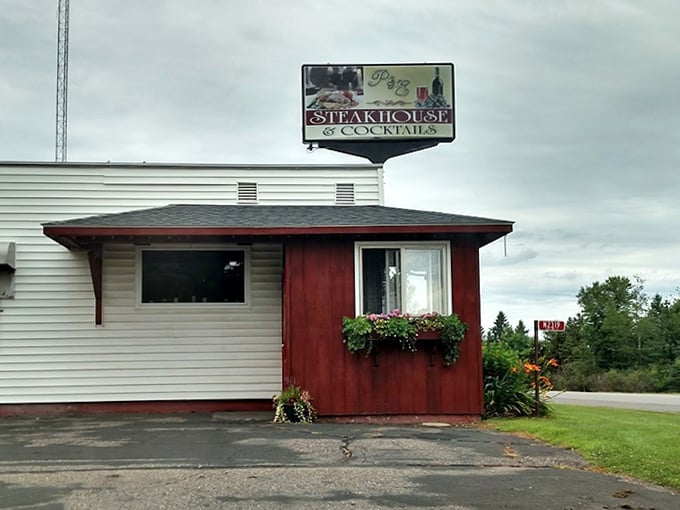 The P & E sign rising above the treetops along the highway is a beacon for anyone who knows that great steak is always worth the detour.