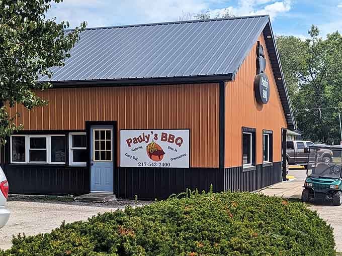 This barn-style building with its modern touches perfectly captures small-town charm meeting serious barbecue craftsmanship and dedication.