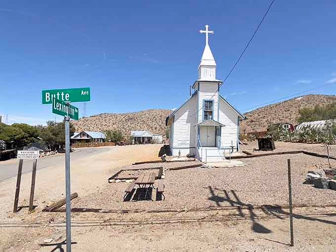 A bright white church at the crossroads of Butte and Lexington, still standing proud in the desert sun.