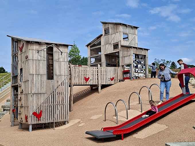 Those weathered barn-style towers transform ordinary playtime into a countryside adventure without leaving the city behind.